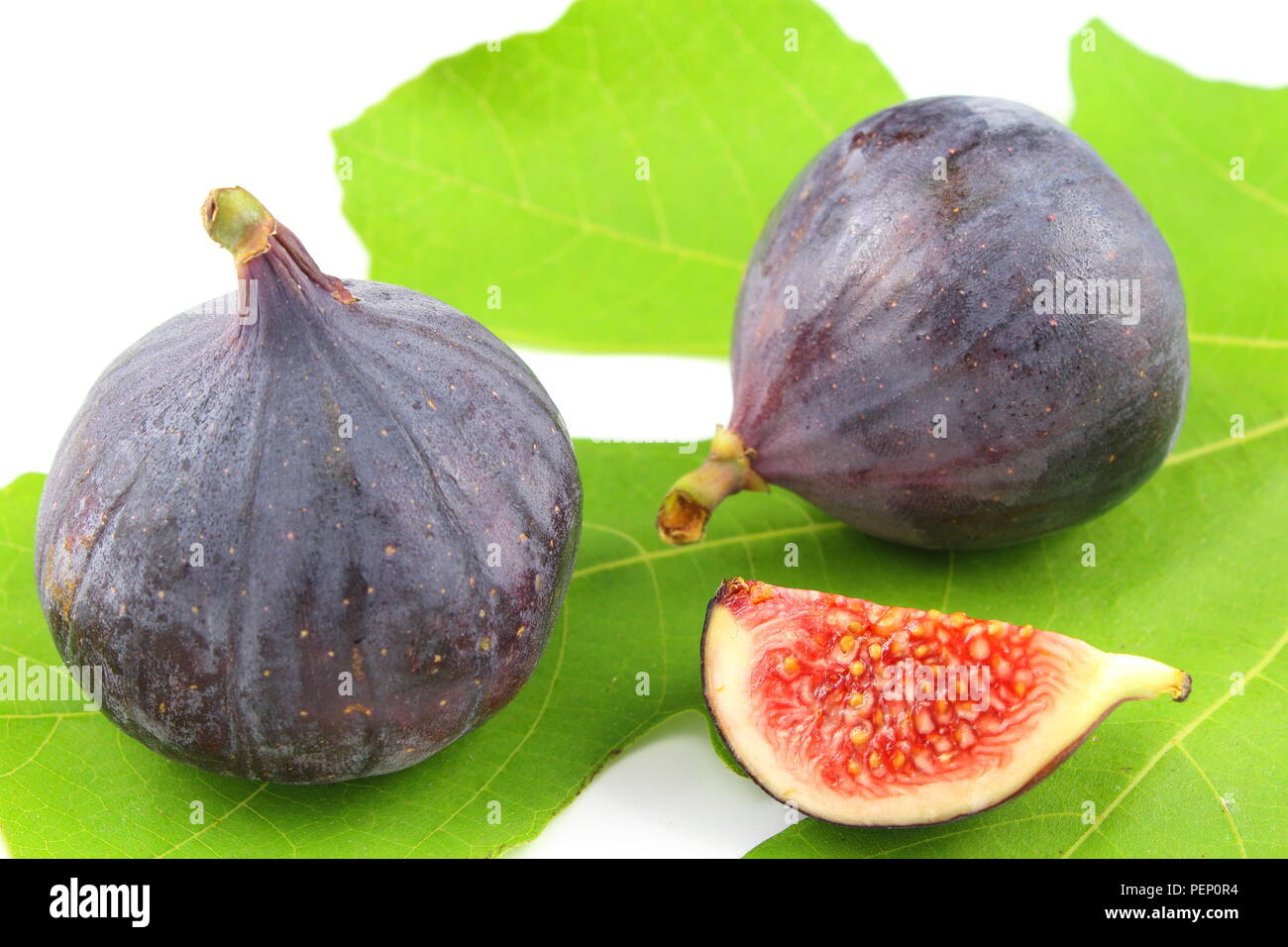 composition of fresh fig fruits on a fig leaf Stock Photo - Alamy