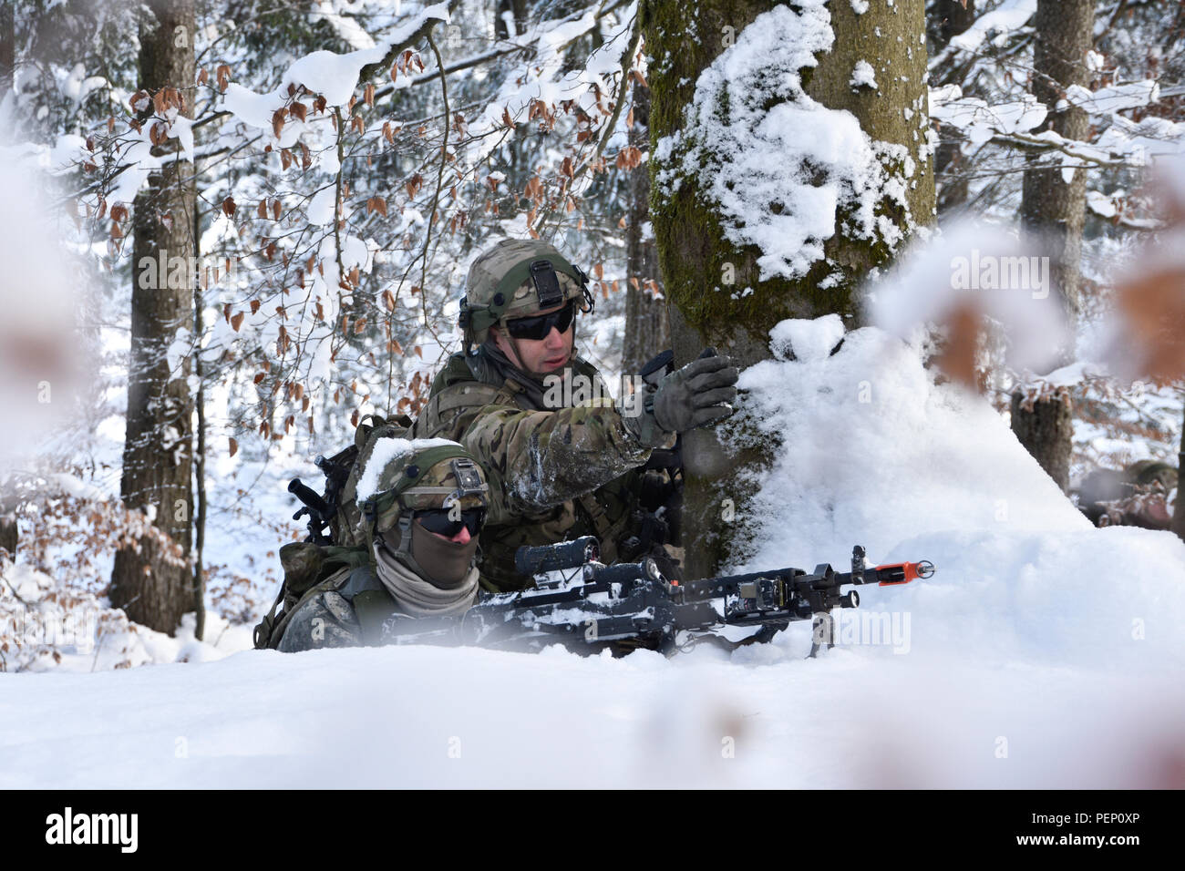 Spc. Bryan Giustra (middle,) an infantryman assigned to Ghost Troop ...
