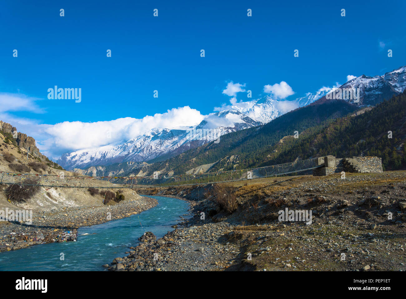 Suspension bridge over the sacred Bagmati river near the village of ...