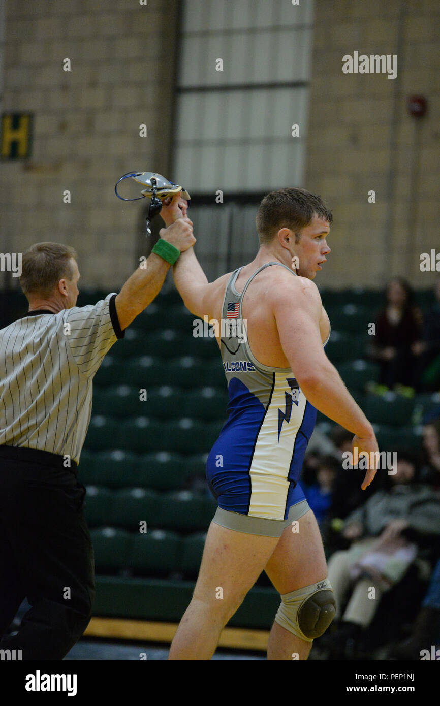 U.S. Air Force Academy cadet Parker Hines, in blue, walks back to his ...