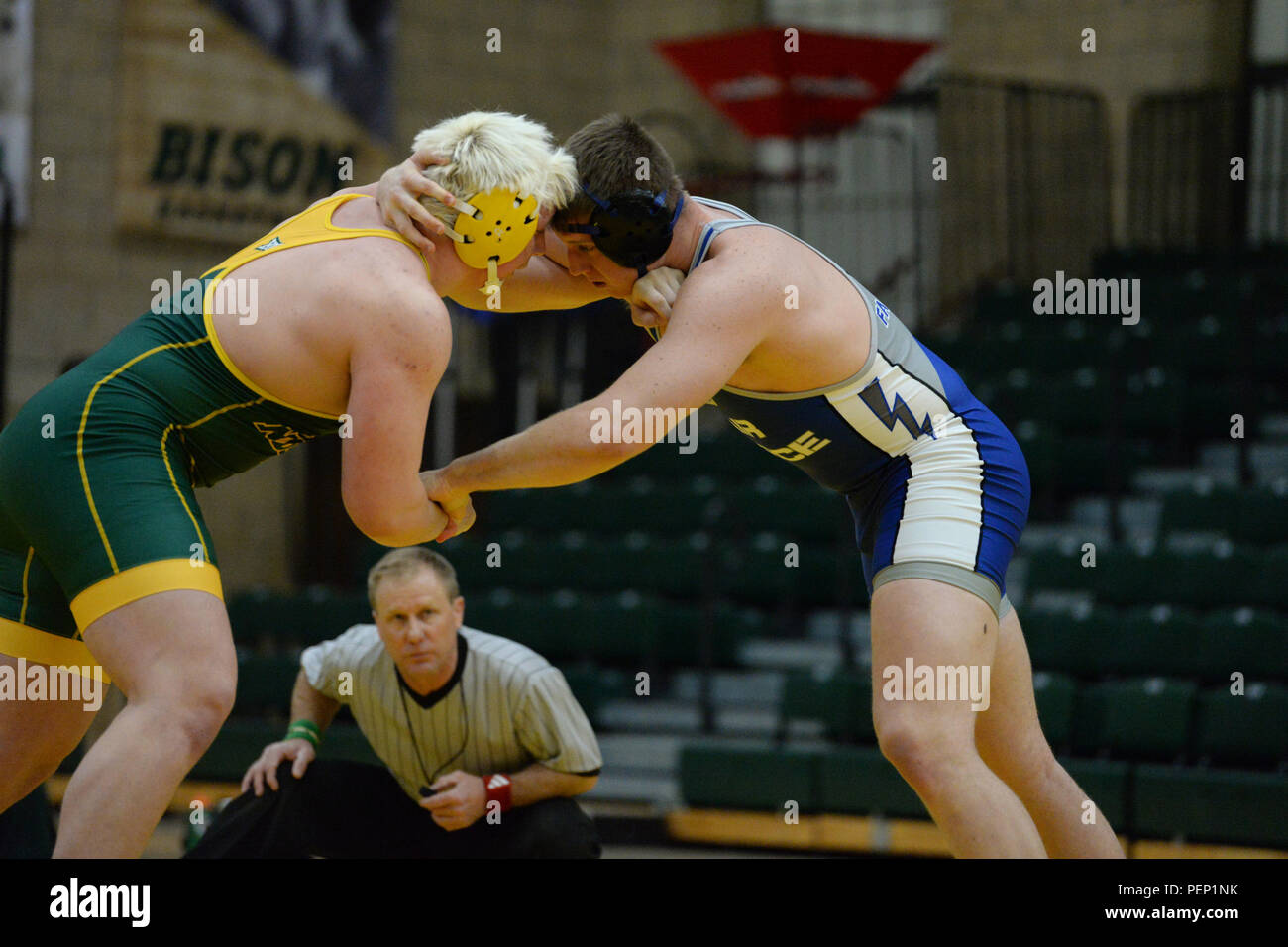 U.S. Air Force Academy cadet Marcus Malecek, in blue, controls the hand ...