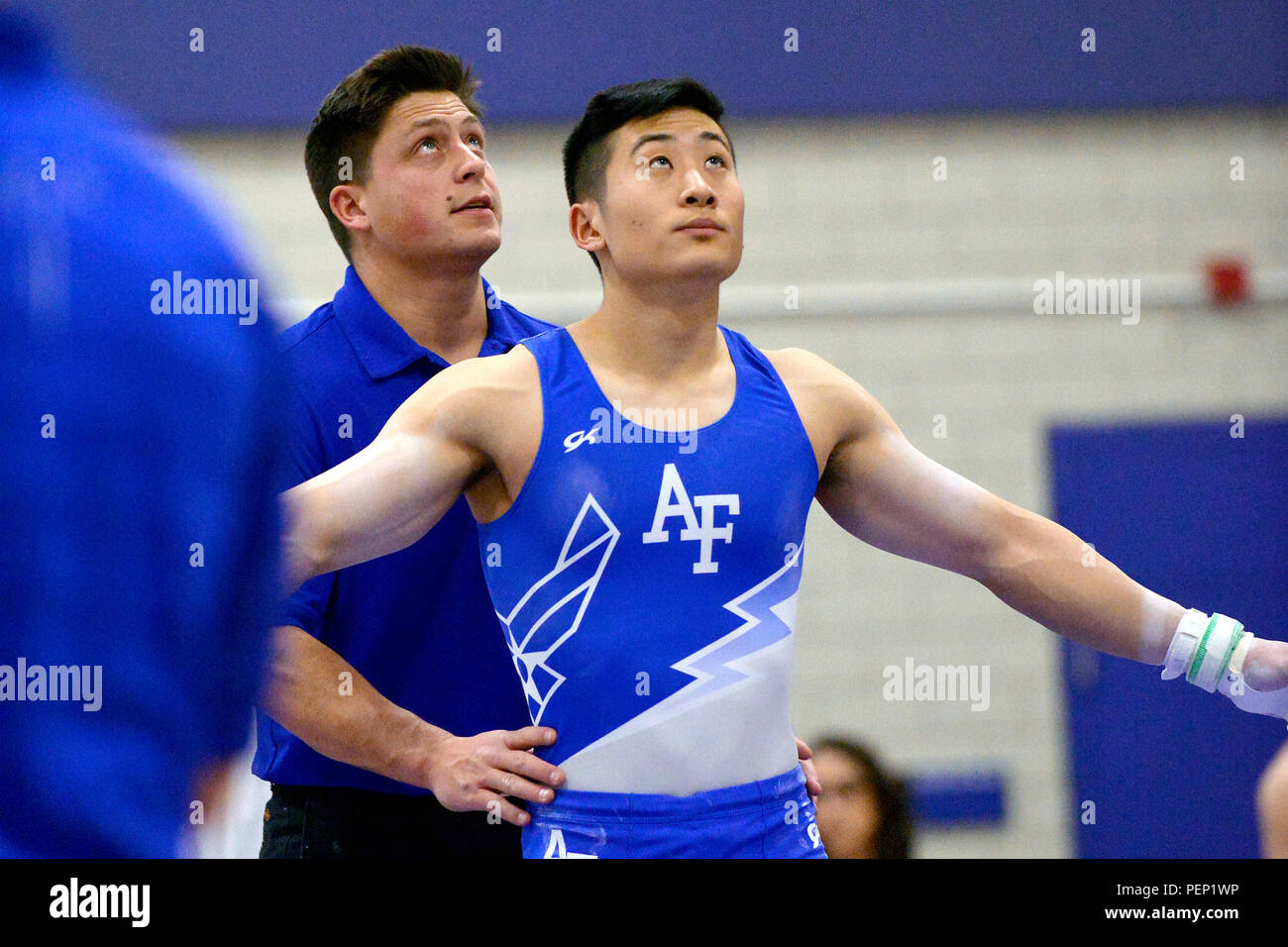 Tim Wang, a junior, gets a lift from Capt. Josiah Loeser, men's ...