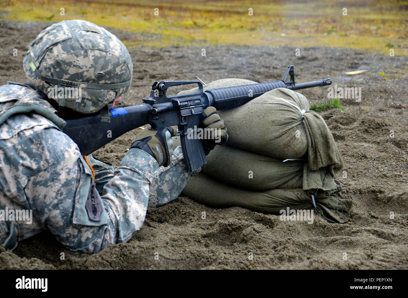 A Soldier from the 42nd Military Police Brigade fires his issued M4 ...