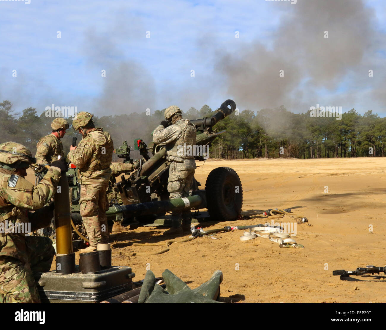 A gun crew assigned to the 82nd Airborne Division Artillery fires a ...