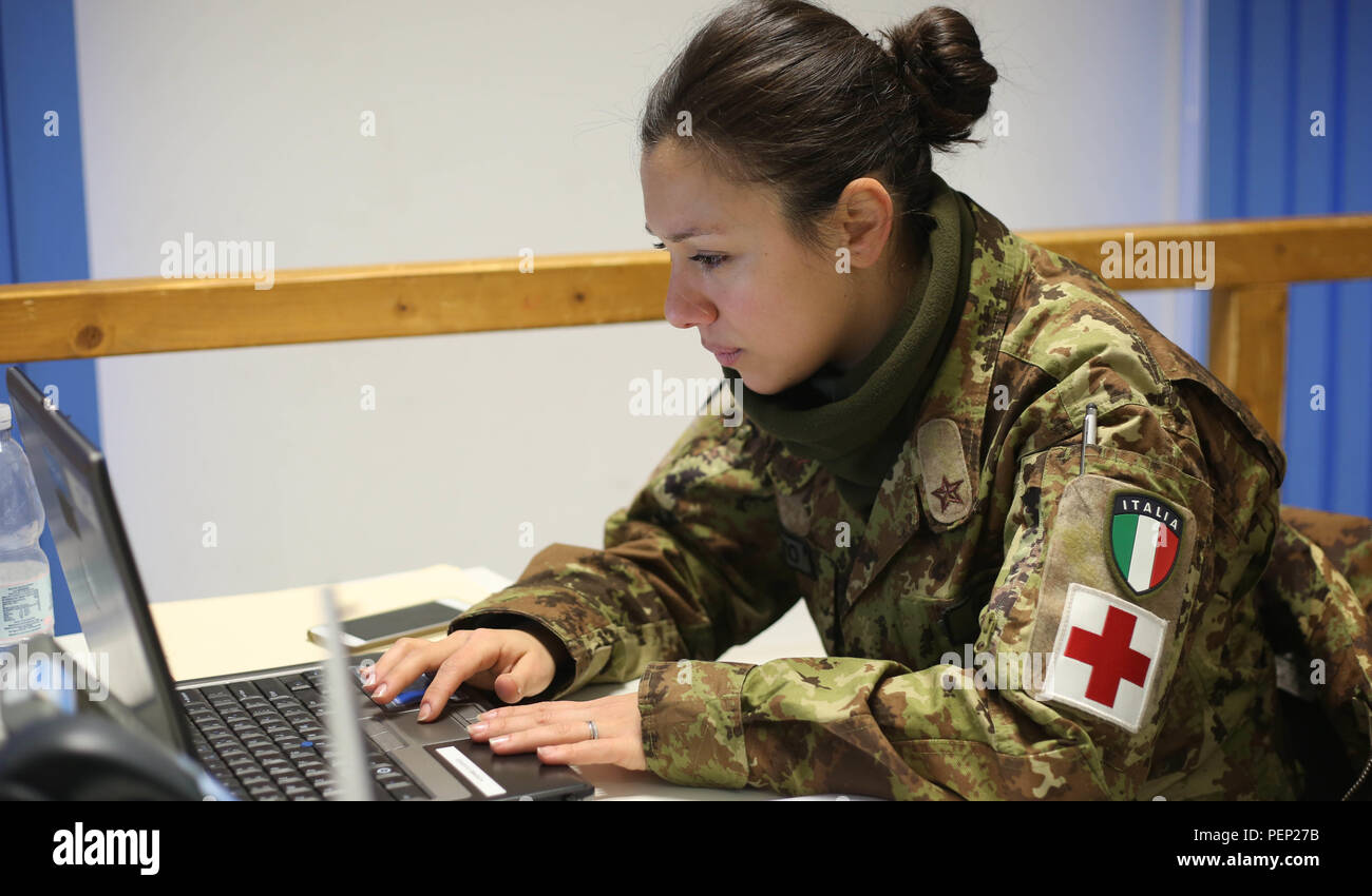 An Italian soldier of the Garibaldi Brigade reviews information on ...