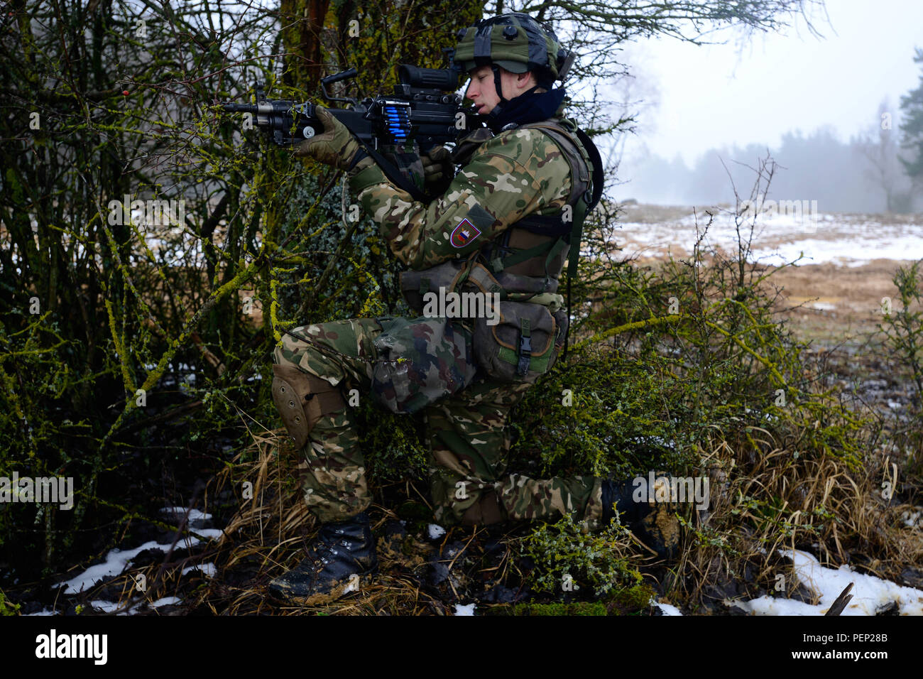 A Slovenian soldier of 3rd Company, 10th Regiment provides security ...
