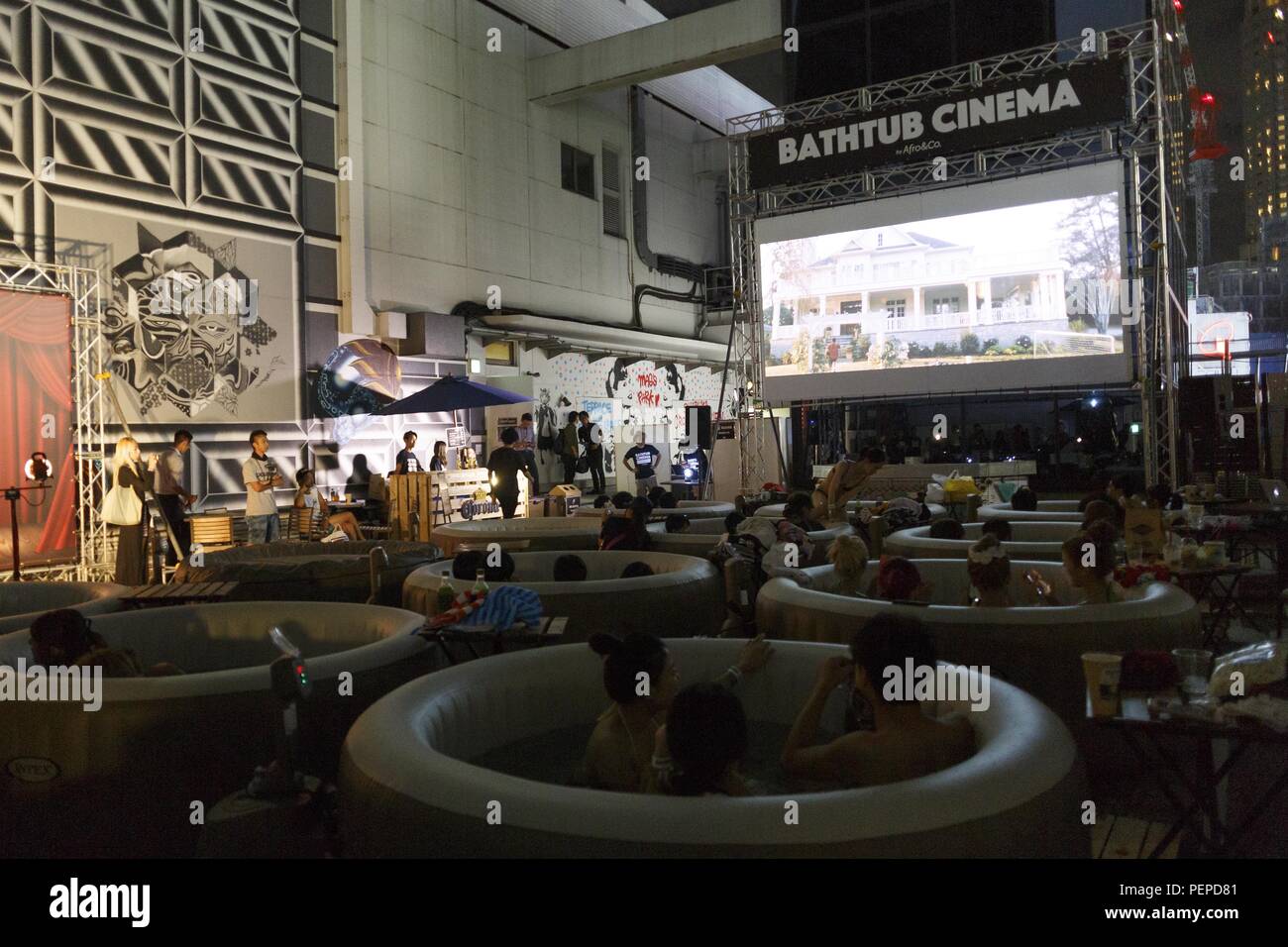Tokyo, Japan. 17th Aug, 2018. People enjoy a movie sitting in small ...