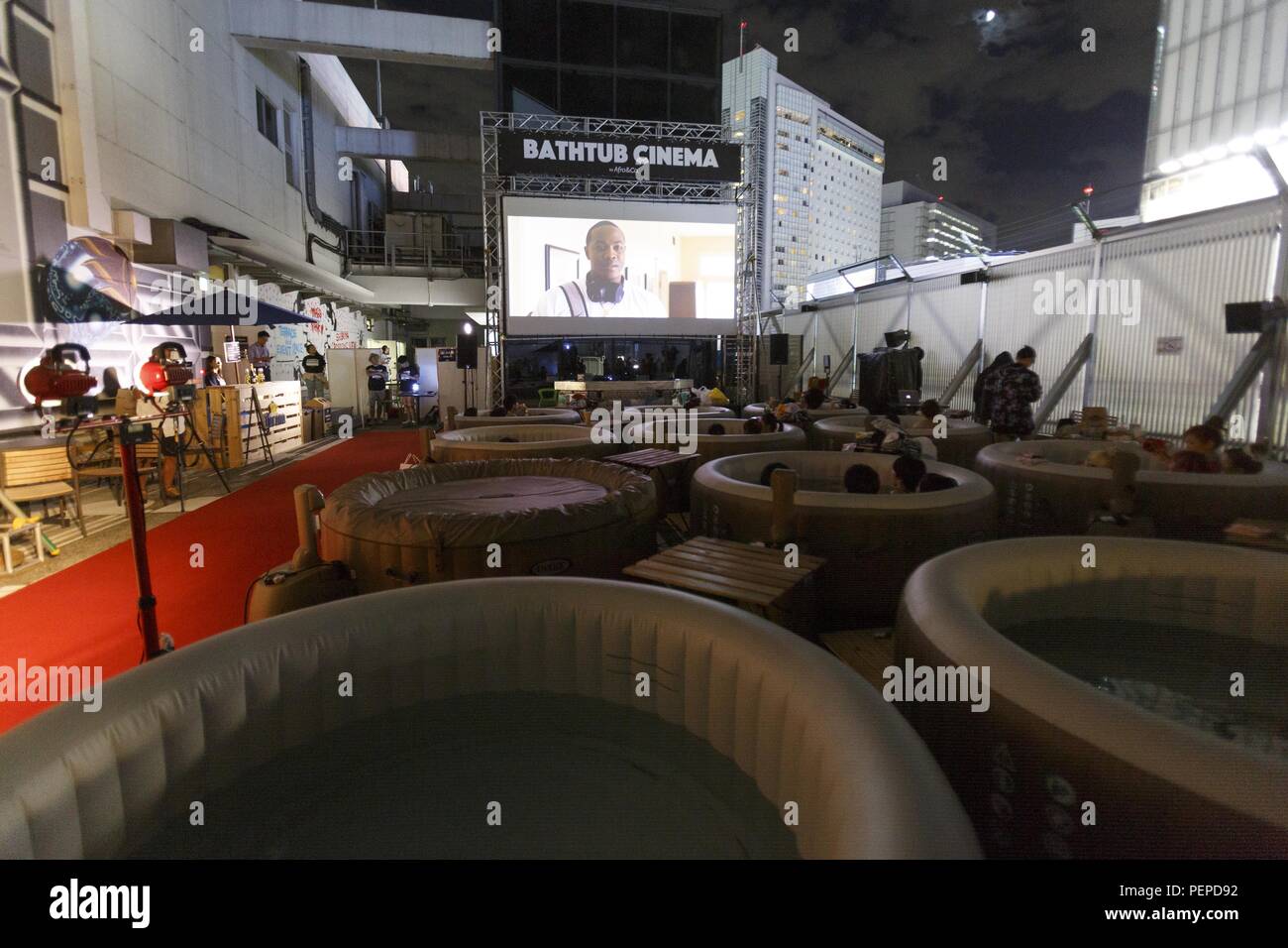 Tokyo, Japan. 17th Aug, 2018. People enjoy a movie sitting in small ...