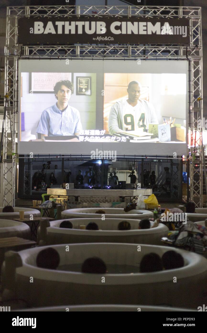Tokyo, Japan. 17th Aug, 2018. People enjoy a movie sitting in small ...