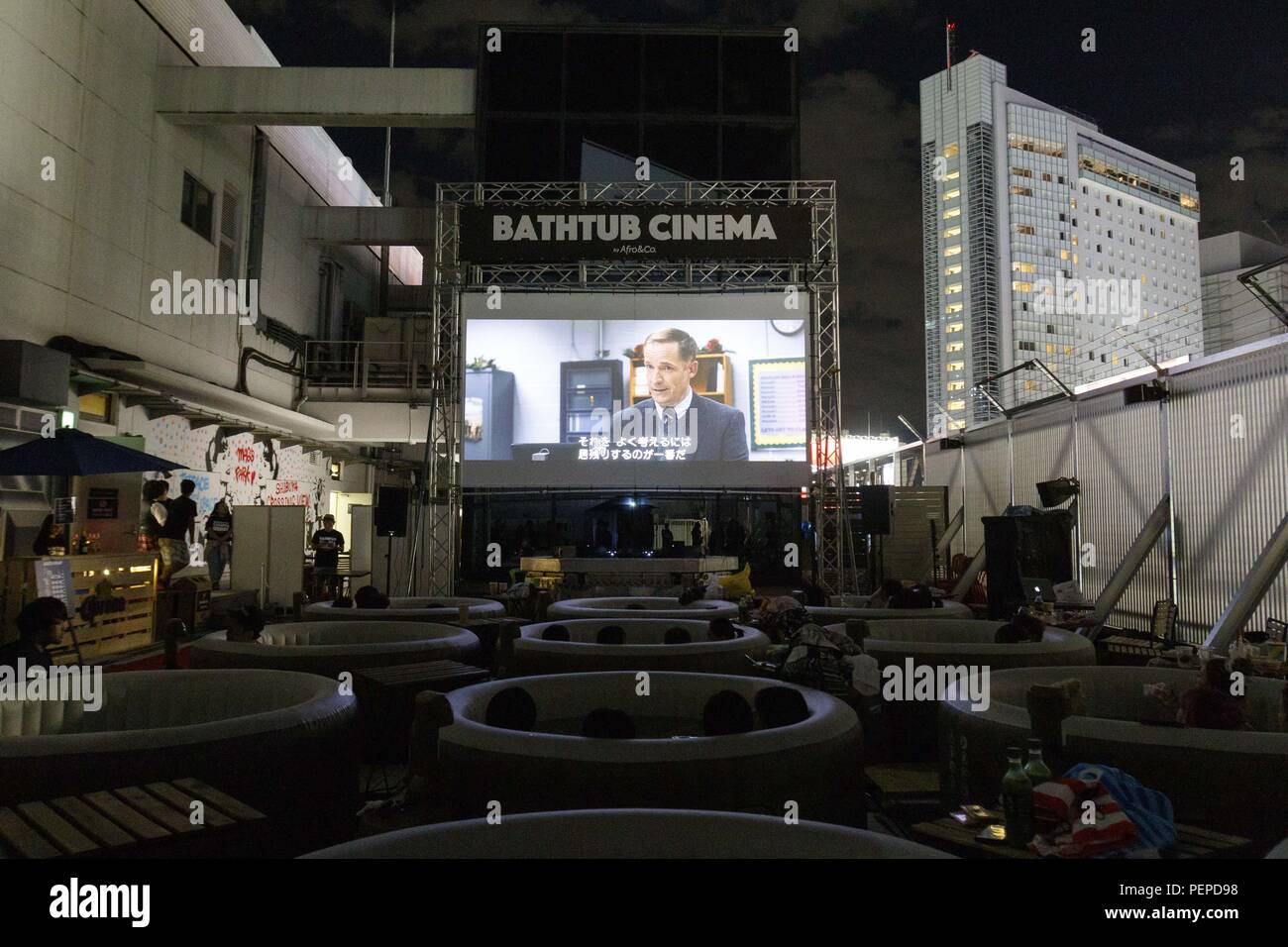Tokyo, Japan. 17th Aug, 2018. People enjoy a movie sitting in small ...