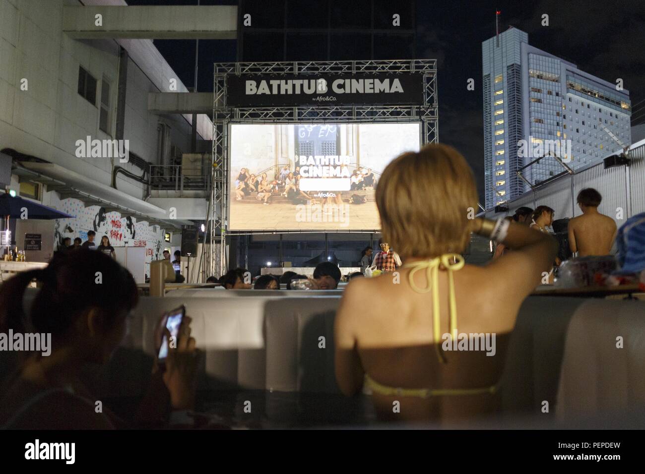 Tokyo, Japan. 17th Aug, 2018. People gather to see a movie in small ...