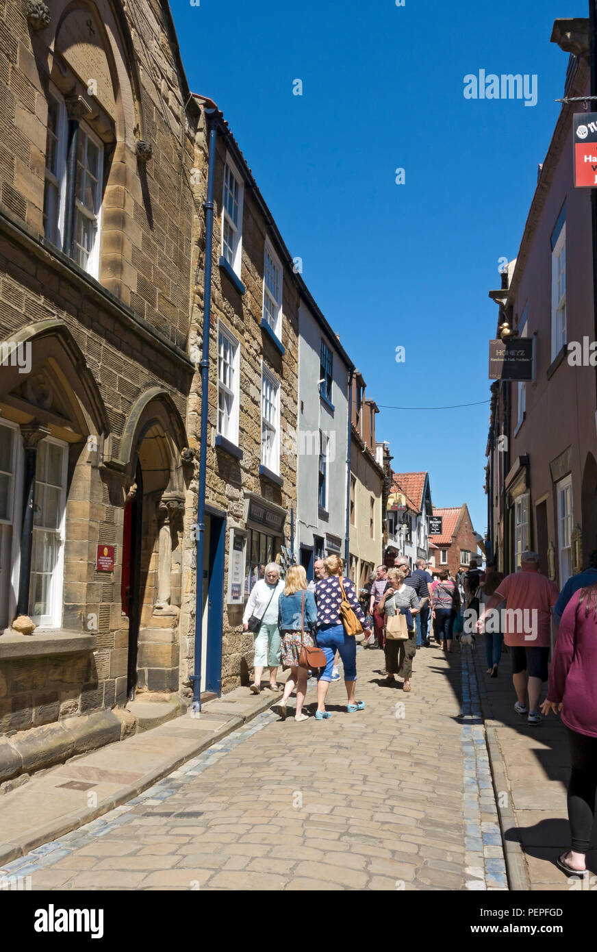 People tourists visitors walking in the town centre in summer Church ...
