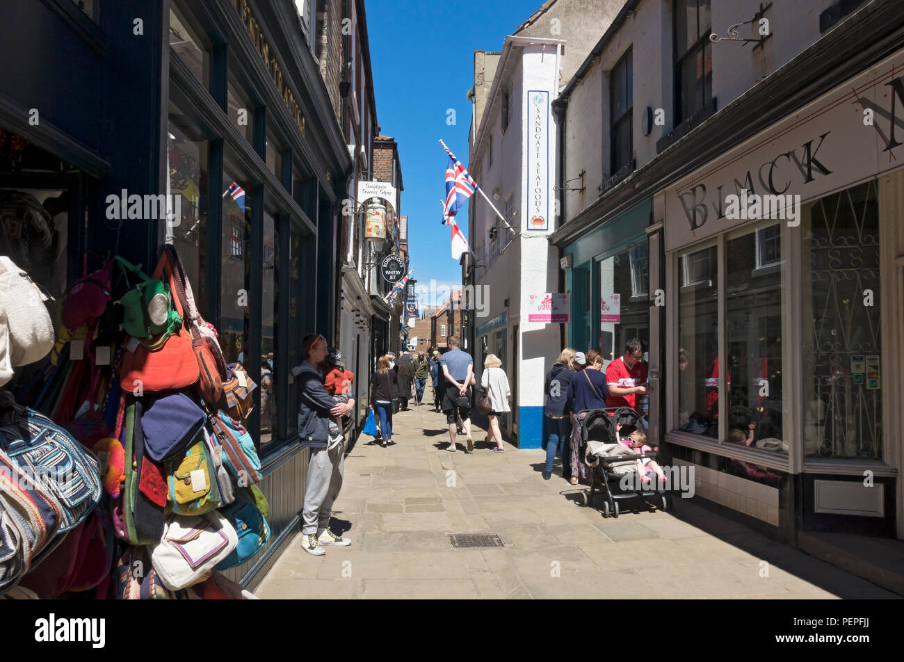 Shops stores businesses in the town centre in summer Sandgate Whitby ...