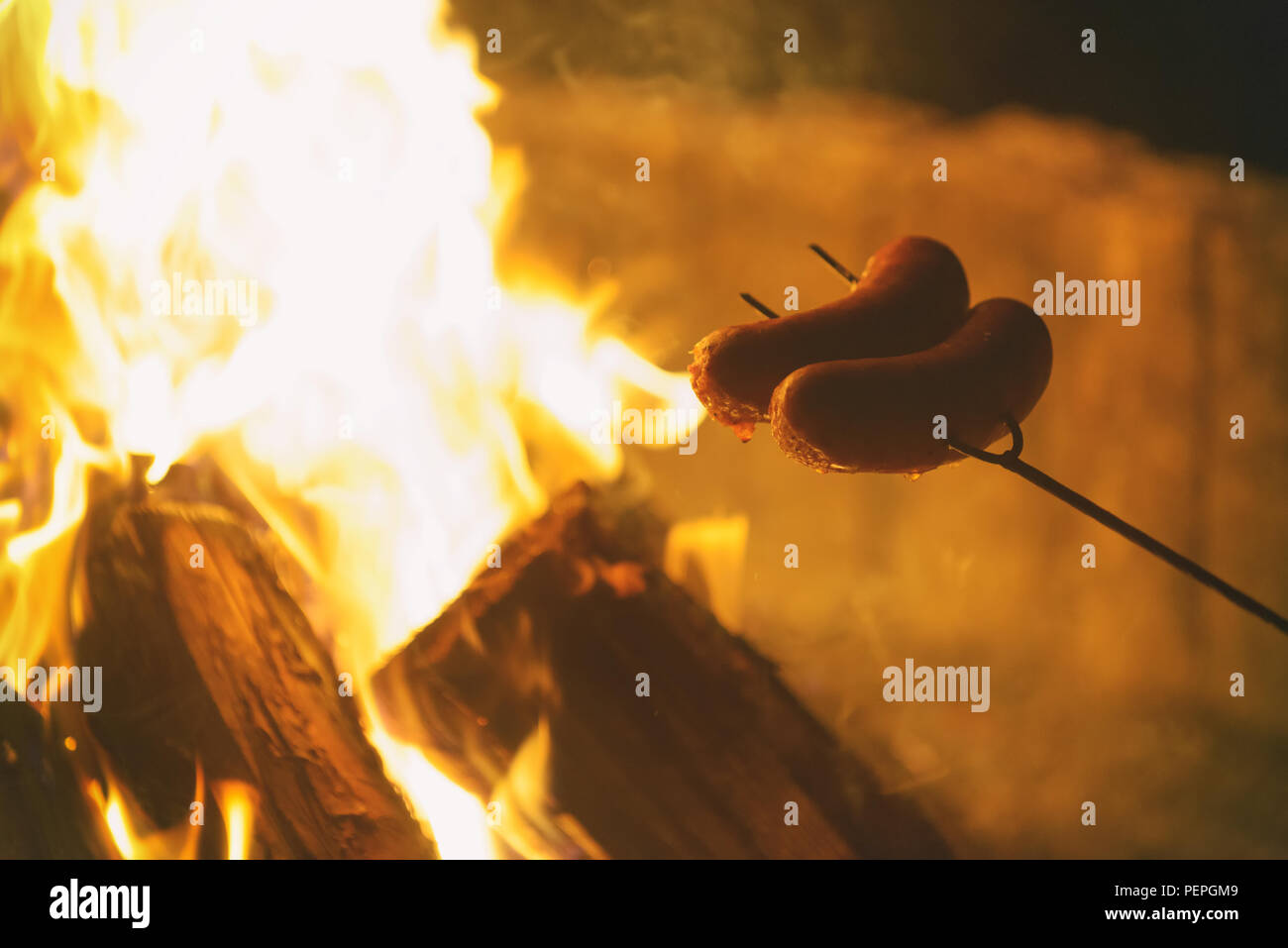 Roasting sausages on fire hi-res stock photography and images - Alamy