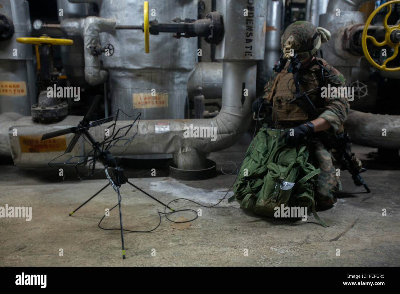 Staff Sgt. Travis Caron sets up satellite communications during a raid ...