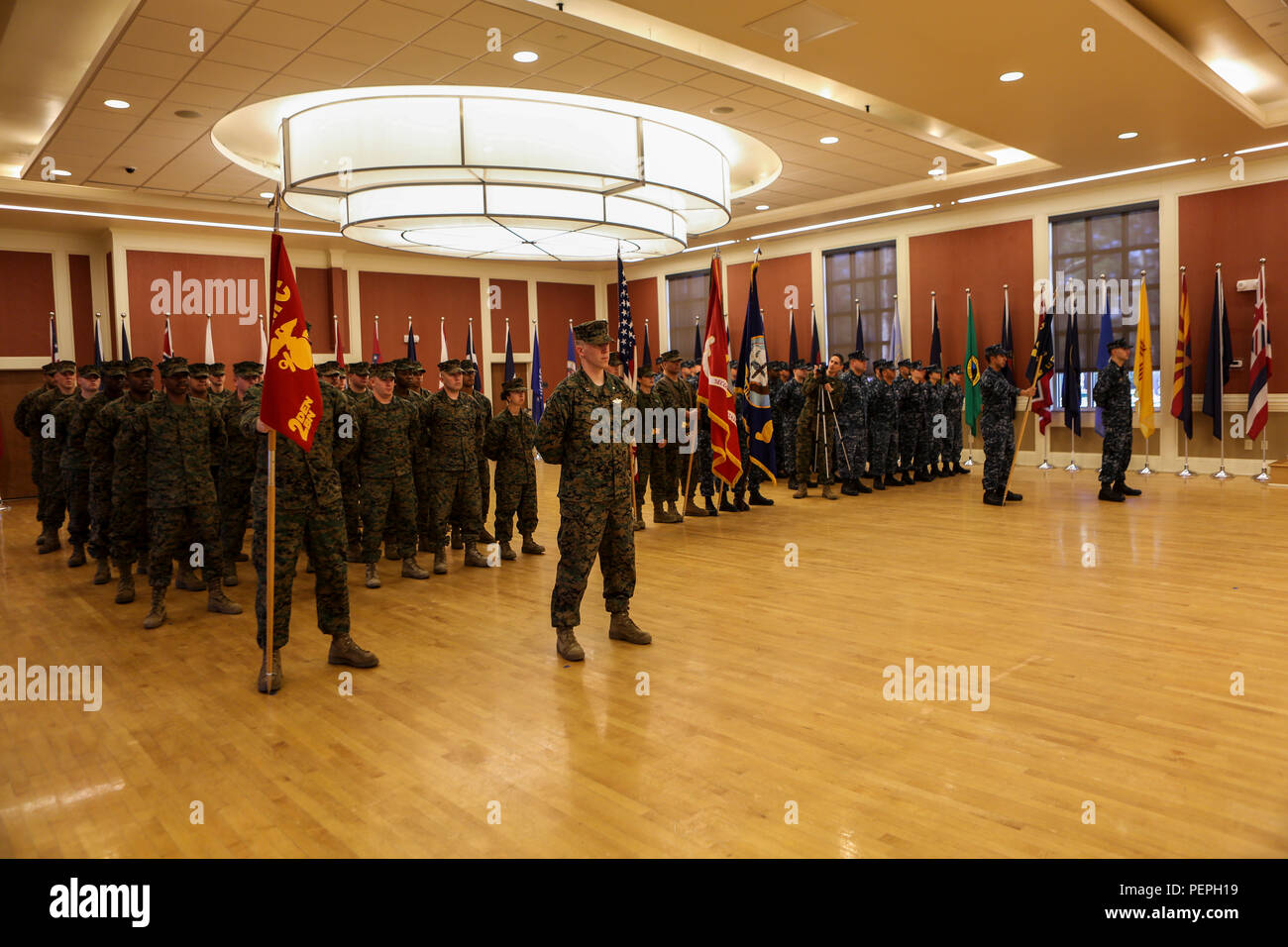 U.S. Sailors assigned to 2nd Marine Logistics Group (2D MLG) stand in ...