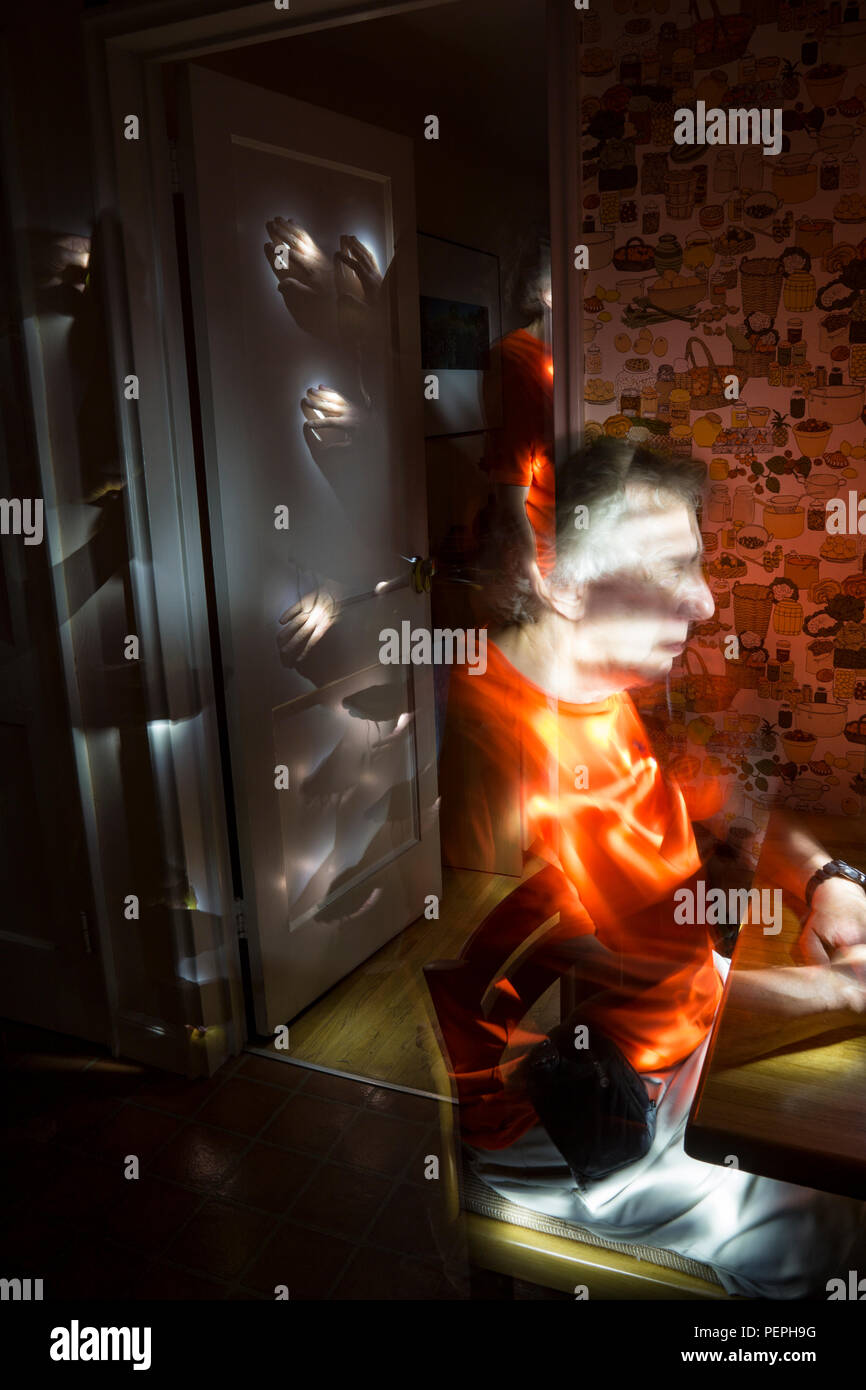 Self portrait in dark room Stock Photo - Alamy