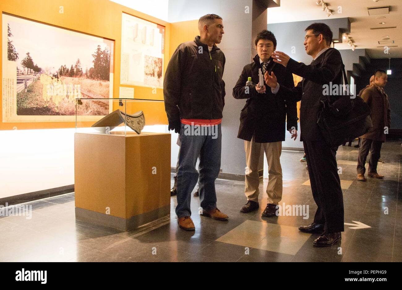 Japan Ground Self-Defense Force (JGSDF) Maj. Hisashi Matsumoto (right ...