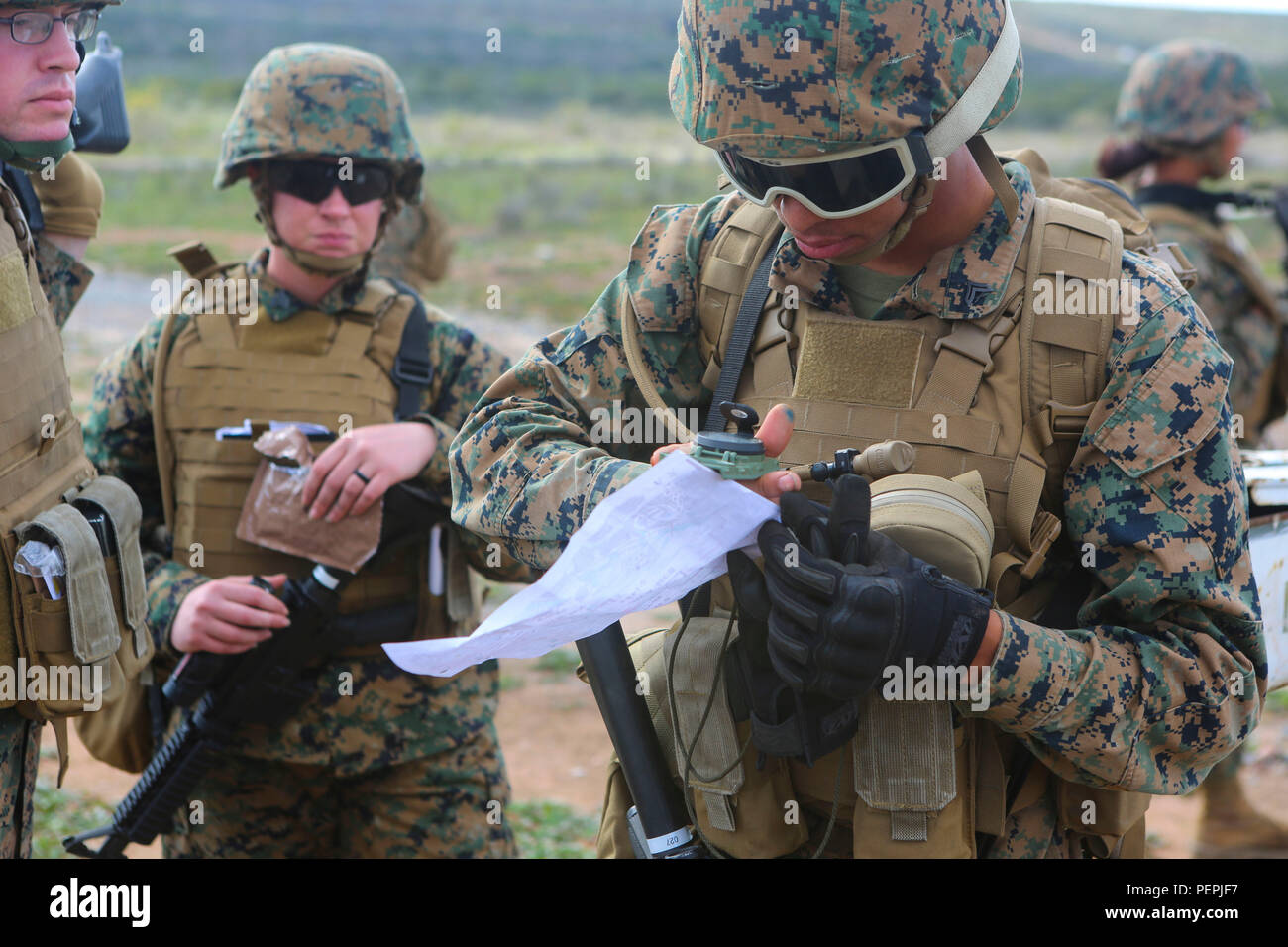 Marines with Marine Wing Headquarters Squadron (MWHS) 3 conduct a land ...