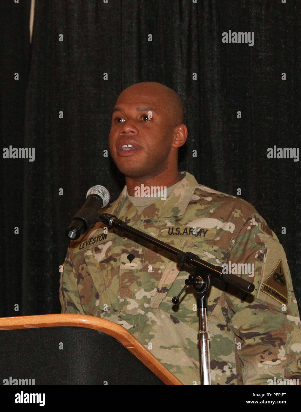 Spc. Joseph Leveston, vocalist with the 1st Armored Division band ...