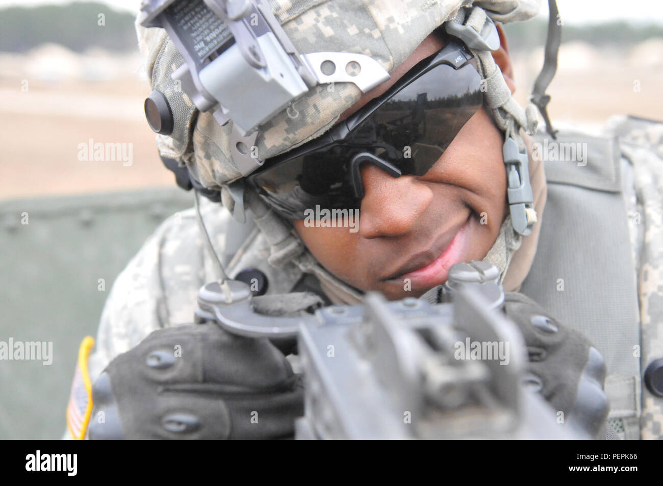 Pvt. Brian Jackson guards along the perimeter of his base to prevent ...