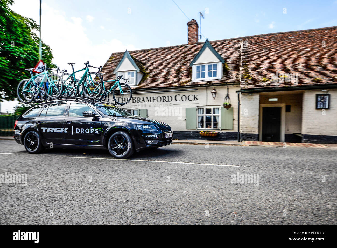Trek Drops team support car passing through Bramford, Suffolk, UK ...