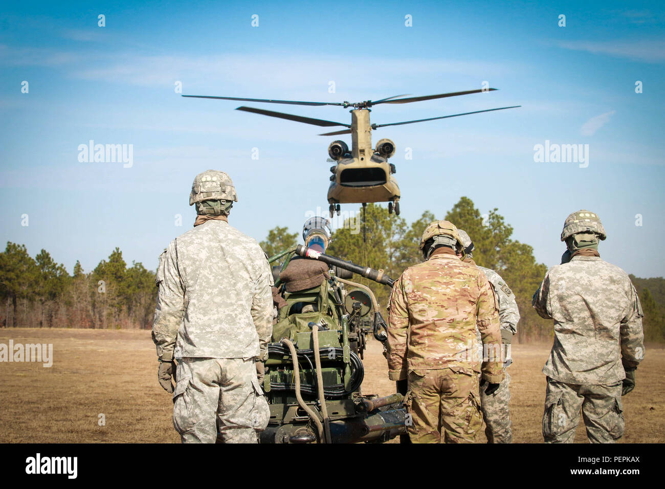 An M119A3 howitzer crew, assigned to 3rd Battalion, 319th Airborne Field Artillery Regiment ...