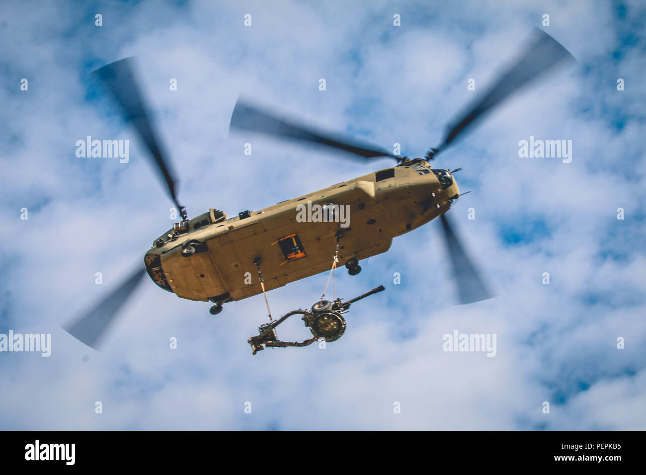 A CH-47 Chinook with the 82nd Combat Aviation Brigade, lifts a two-ton ...