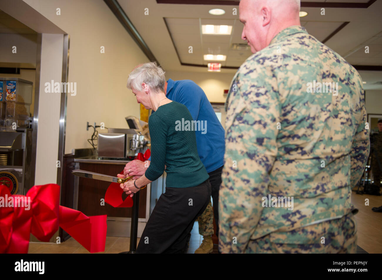 James and Alison Malachowski cut the ribbon to open the new Weapons ...