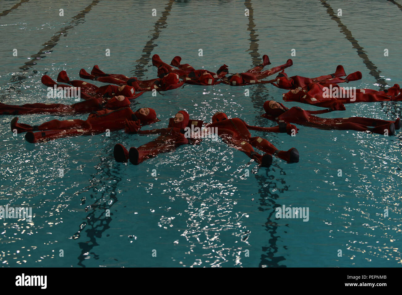 U.S. Army Soldiers swim form a circle during the survival swimming ...