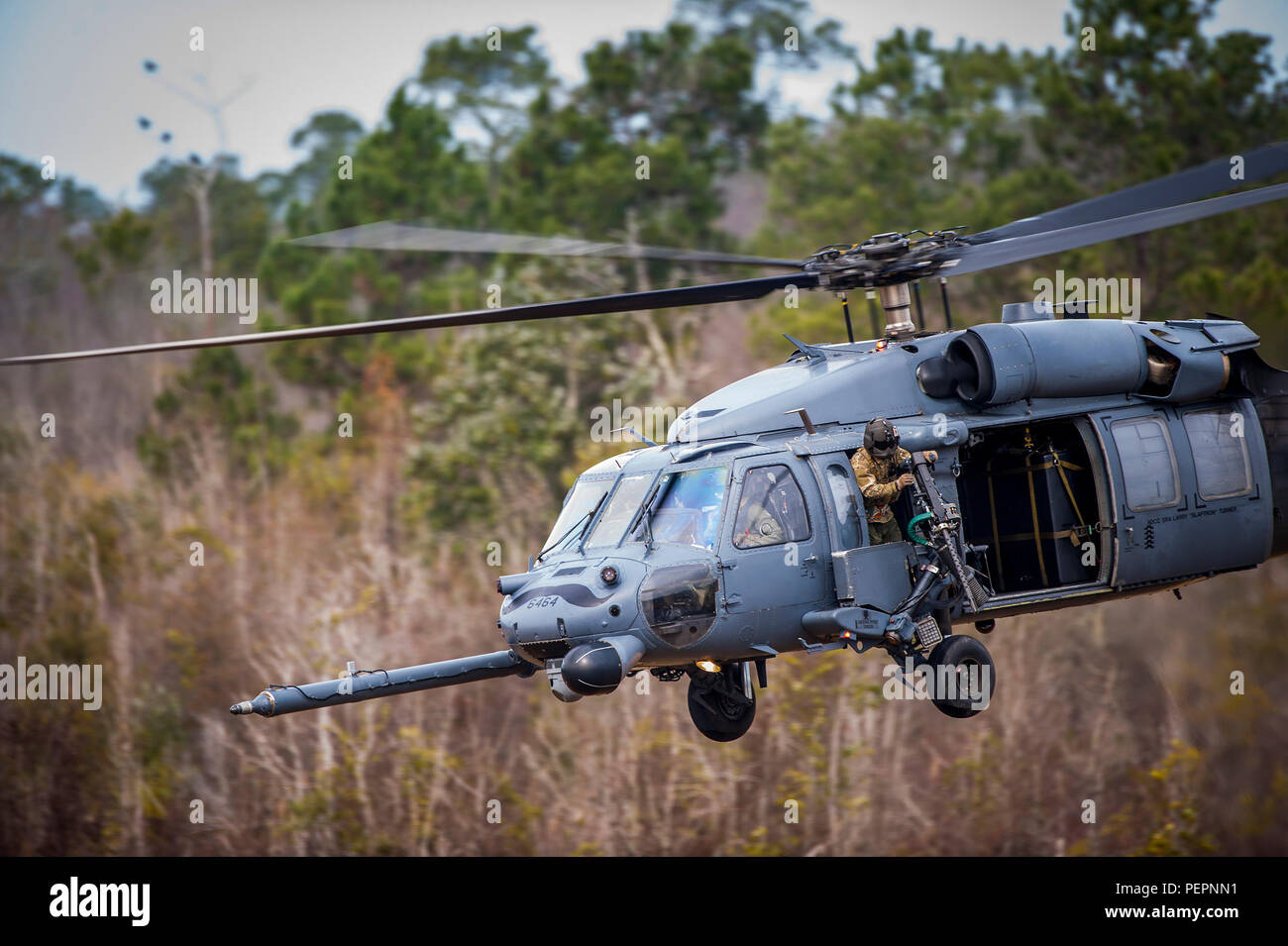 Airmen from the 41st Rescue Squadron take off in an HH-60G Pave Hawk ...
