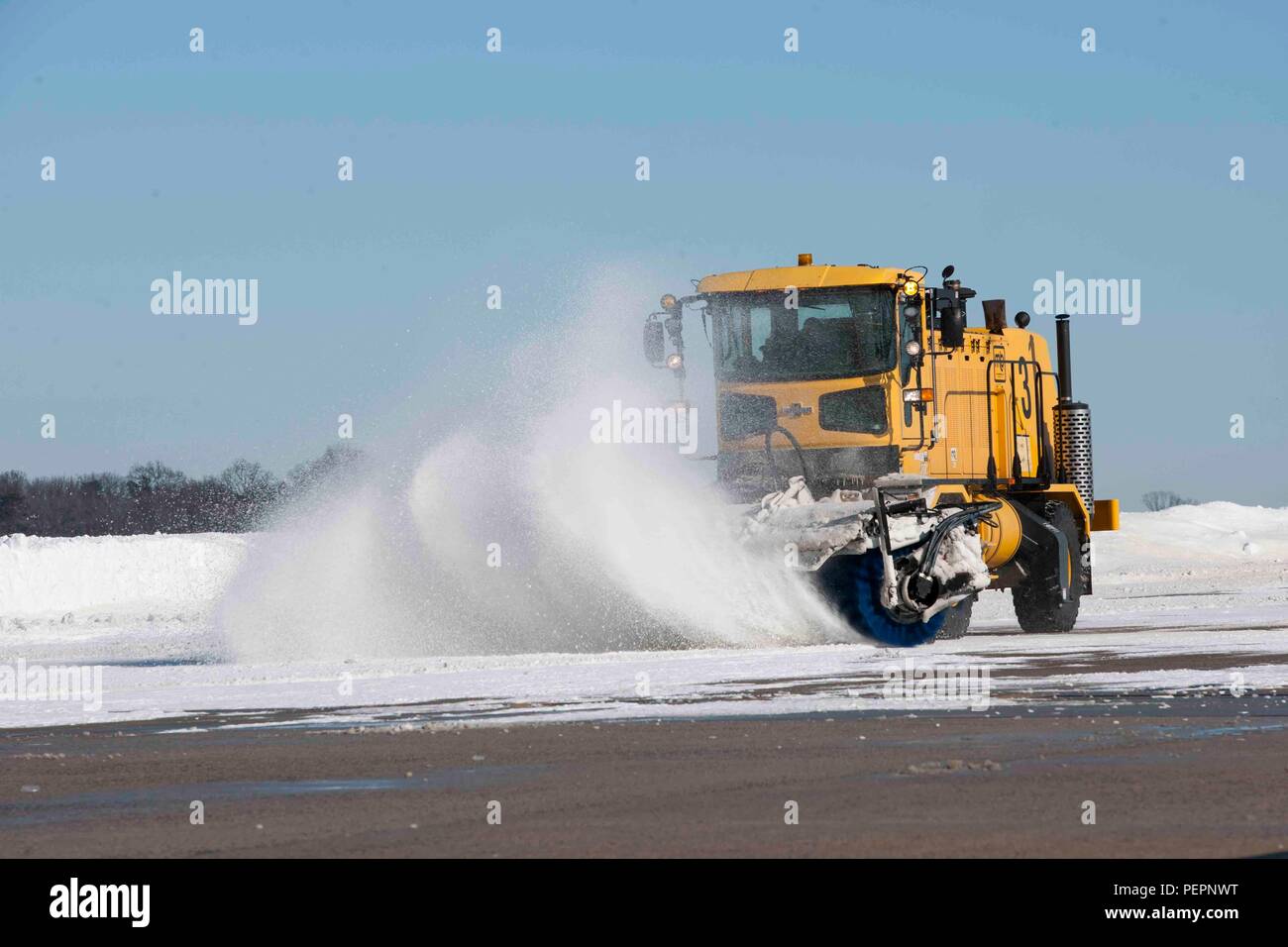 An 11th Civil Engineer Squadron snow removal vehicle plows snow on the ...