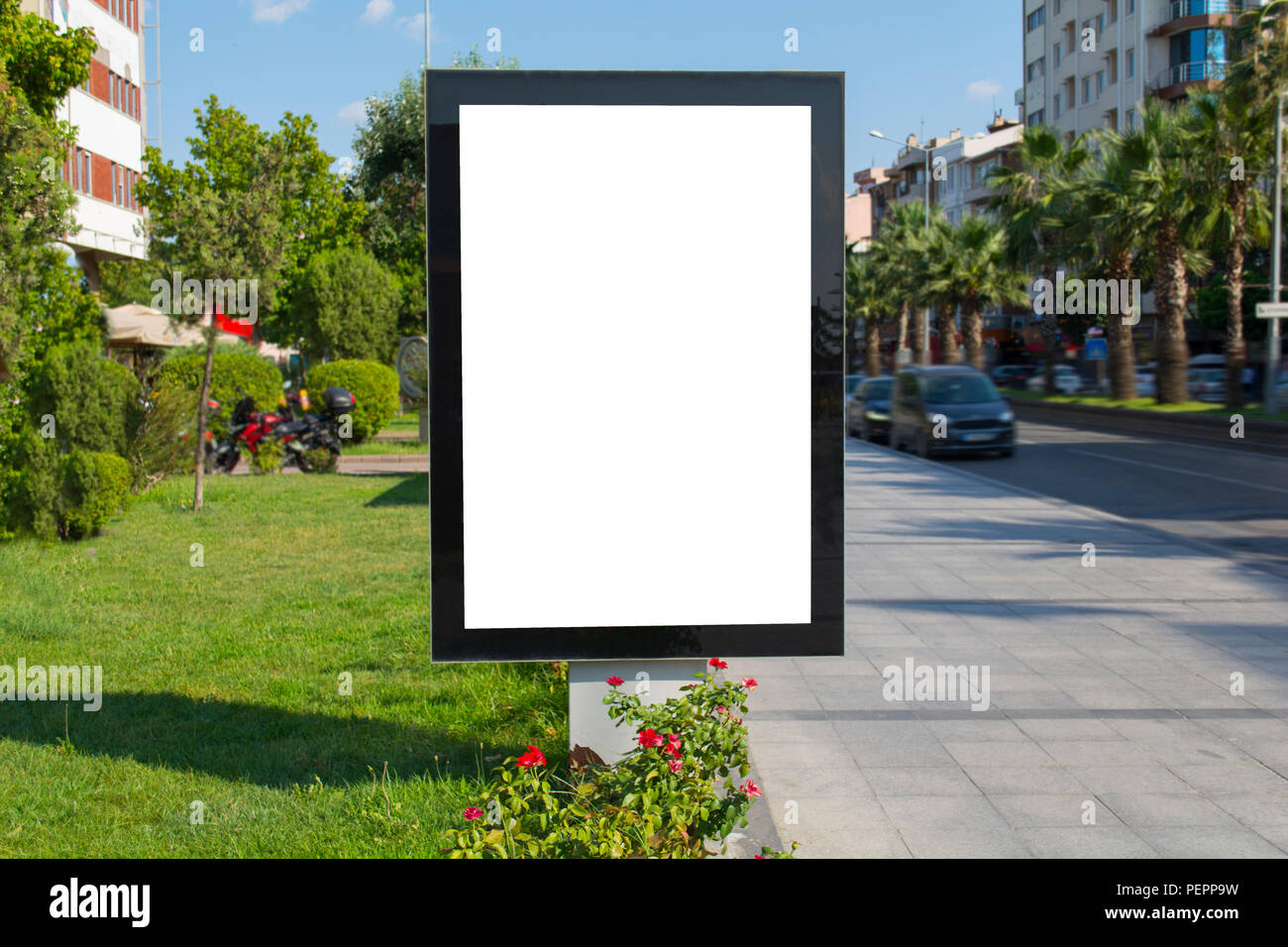 Blank mock up of vertical street poster billboard on city background ...