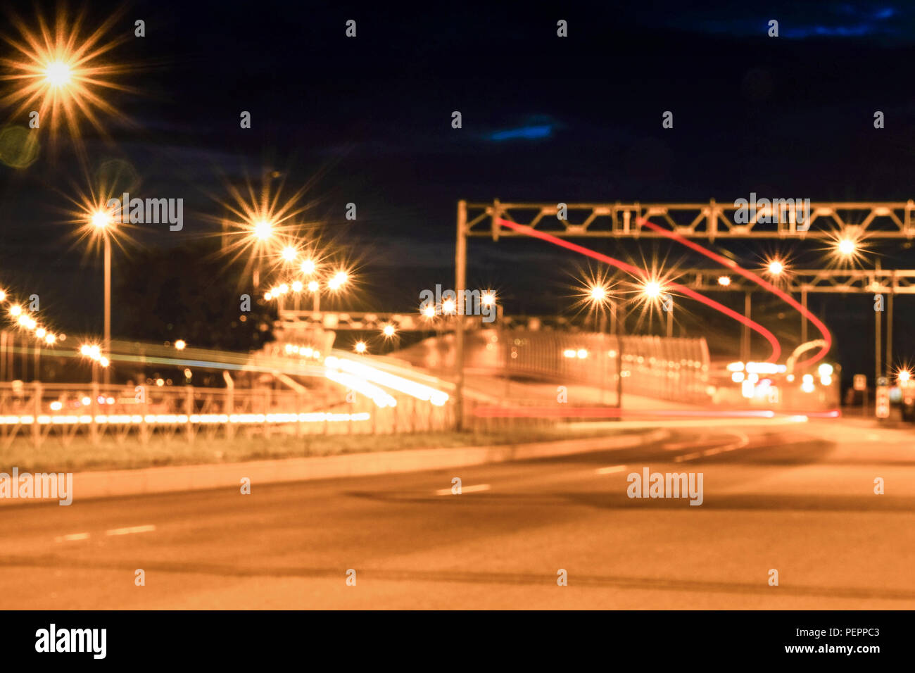 Blur of auto headlights at night hi-res stock photography and images ...