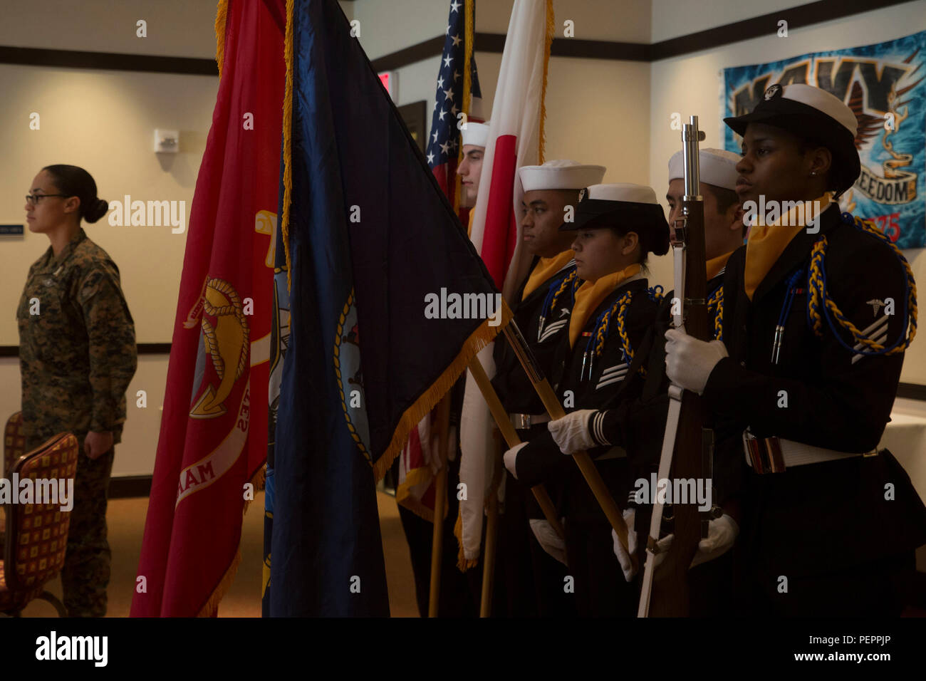 Sailors in a U.S. Navy color guard stand at attention for the U.S ...