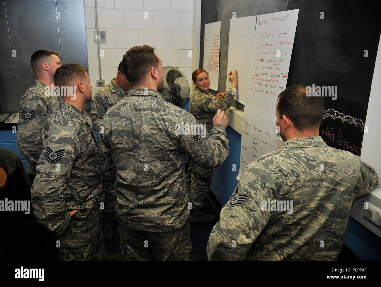 Airmen from the 86th Airlift Wing solve a simulated problem during ...
