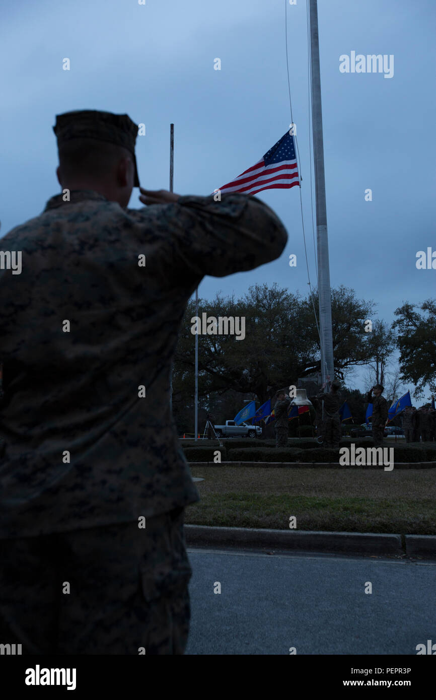 A U.S. Marine with 2nd Marine Logistics Group (2nd MLG) salutes the ...
