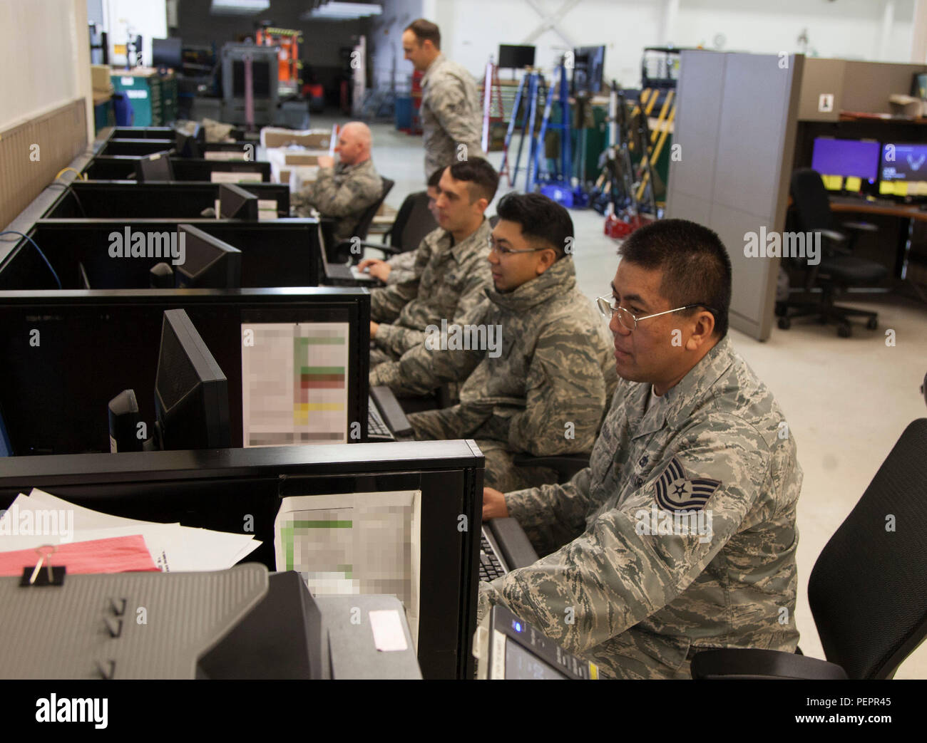 Members of the 349th Maintenance Squadron study using computer-based ...