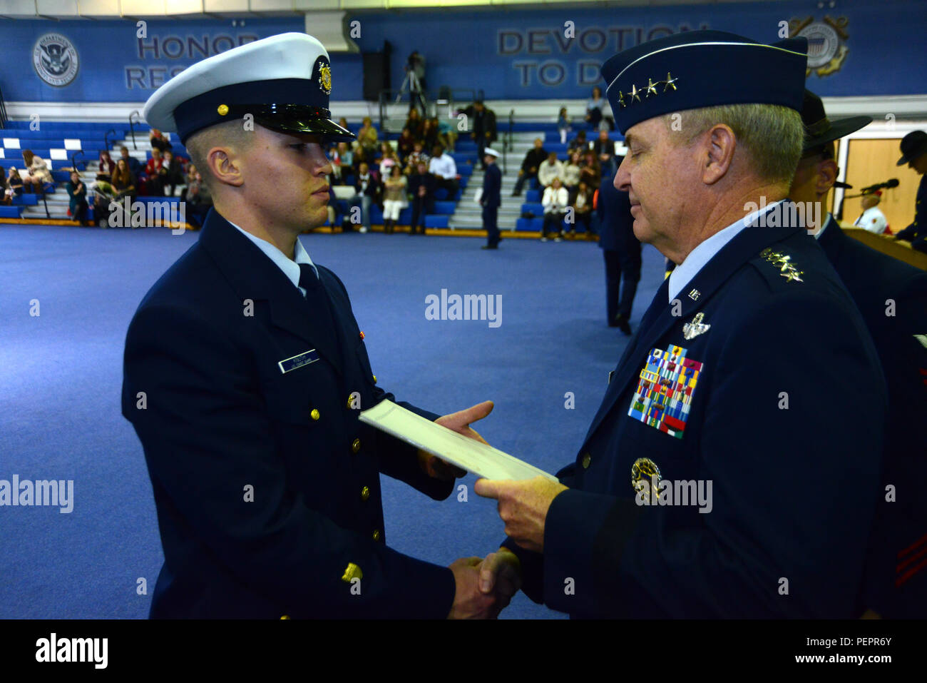 The Chief of Staff of the U.S. Air Force, Gen. Mark A. Welsh III, hands ...