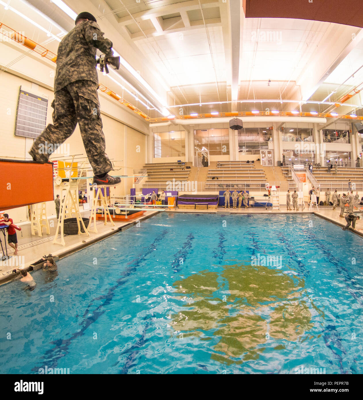 A blindfolded U.S. Army Reserve Officers' Training Corps cadet steps ...
