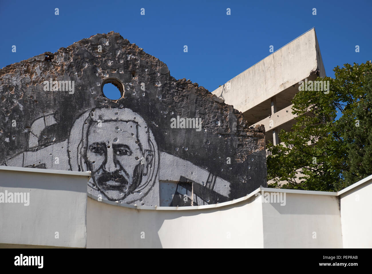Wall painting of Bosnian poet Aleksa Santic on a war damaged house in ...