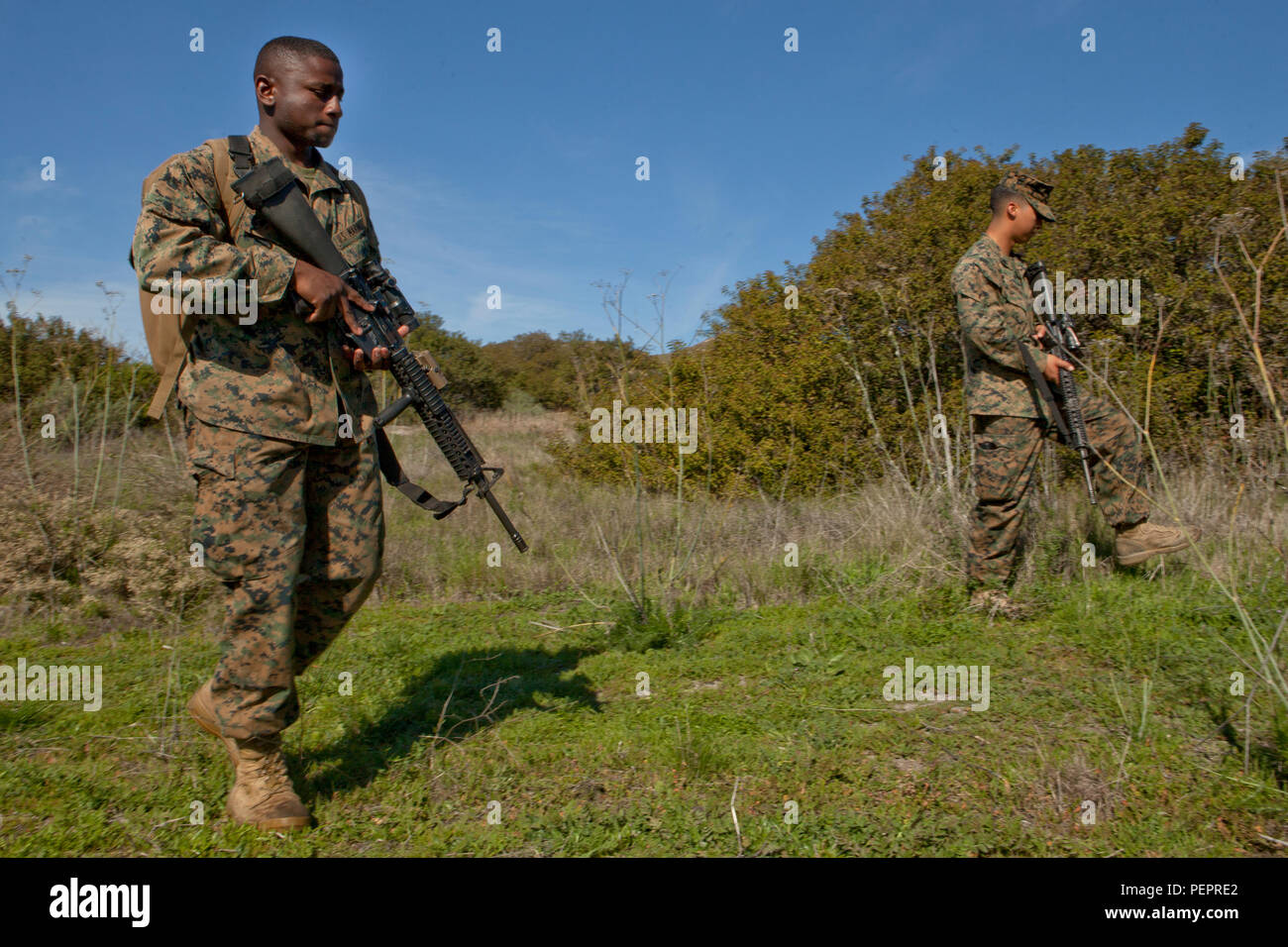 U.S. Marines with 3rd Low Altitude Air Defense Battalion patrol while ...