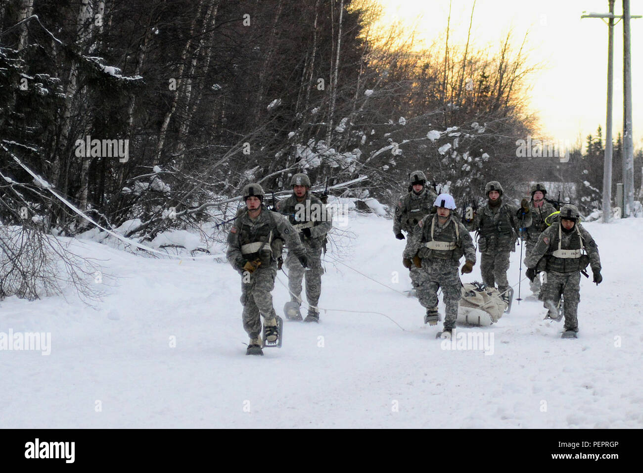 Soldiers use teamwork to drag an ahkio sled loaded with 300-plus pounds ...