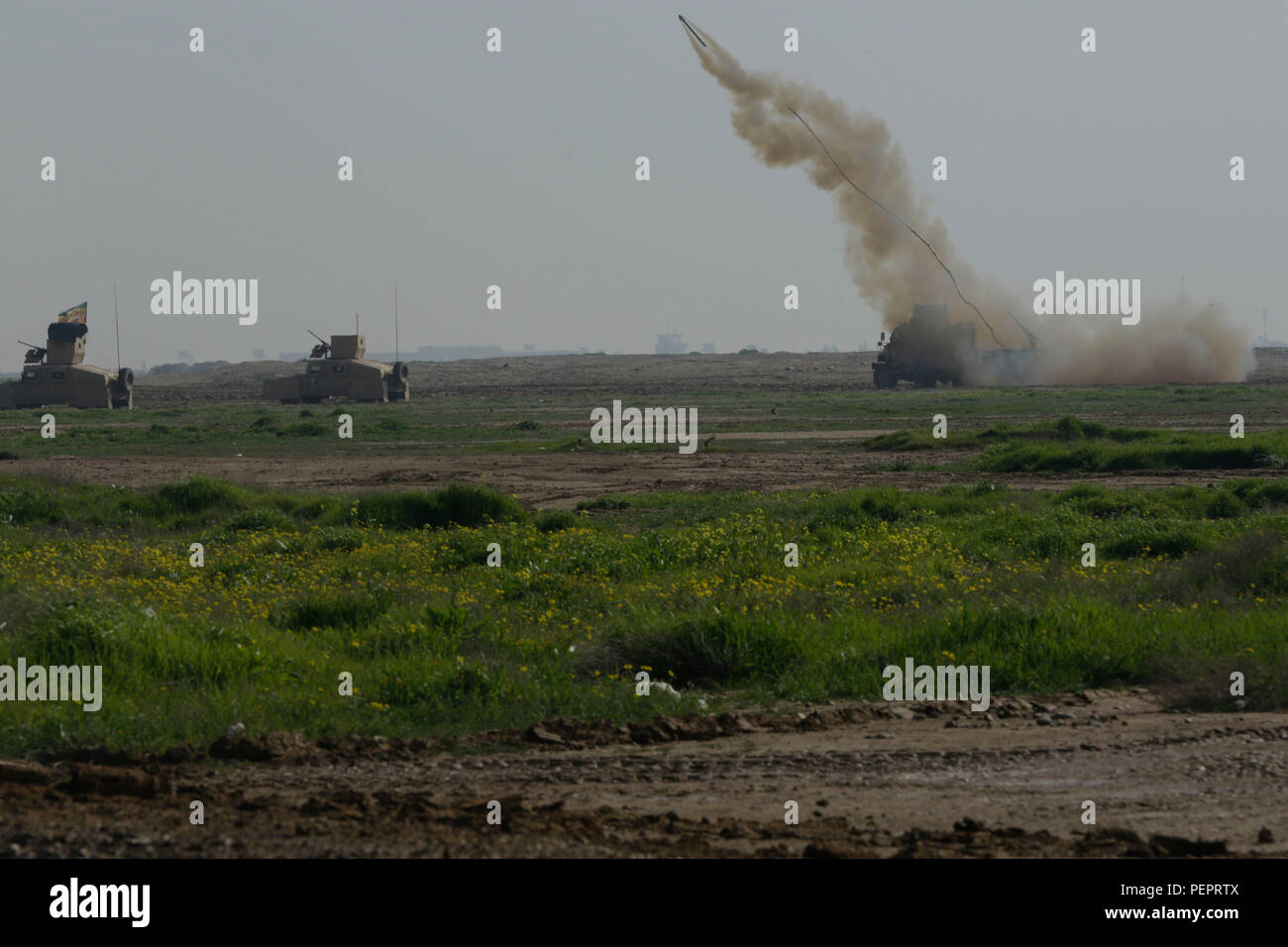 Iraqi soldiers from the 72nd Iraqi Army Brigade fire an M58 Mine ...