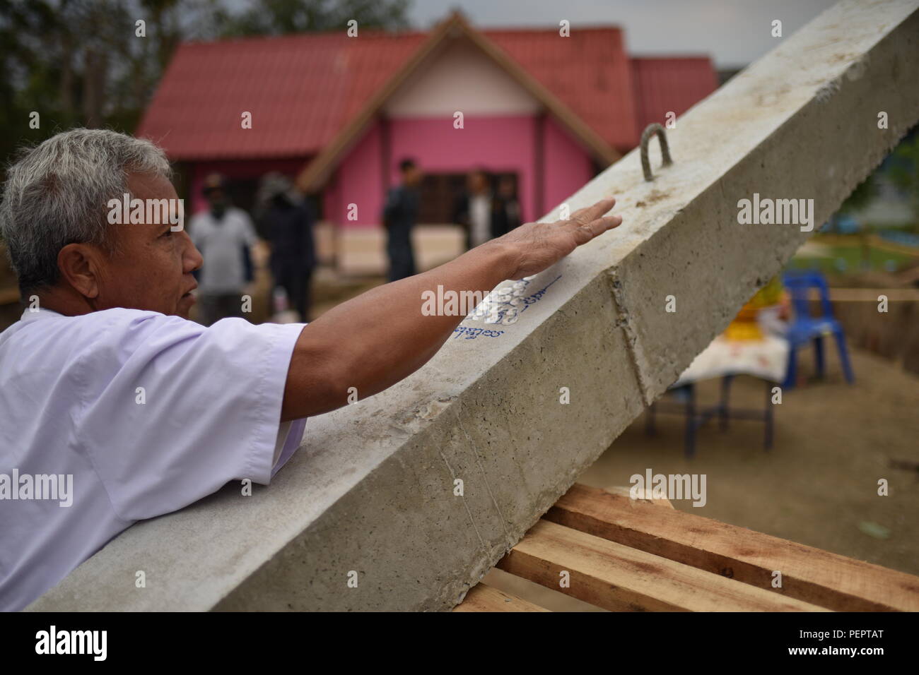 Samai Tanapai Bul blesses a pillar at the Wuat Ban Mak school during ...