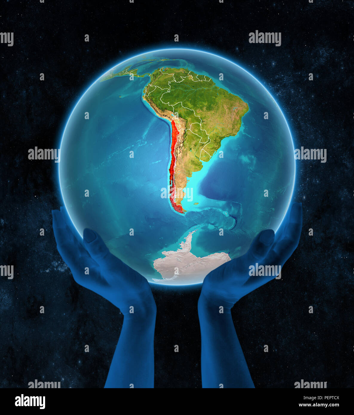 Chile on planet Earth with visible country borders in hands in space ...