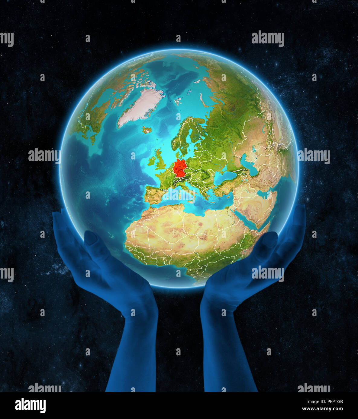 Germany on planet Earth with visible country borders in hands in space ...