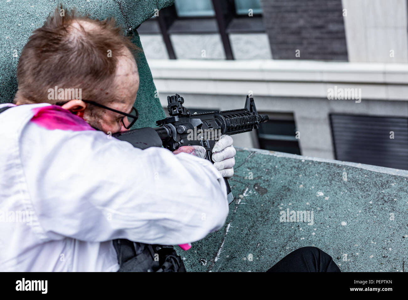 man took aim with the pistol. Action Movie Style. Close up, back view ...