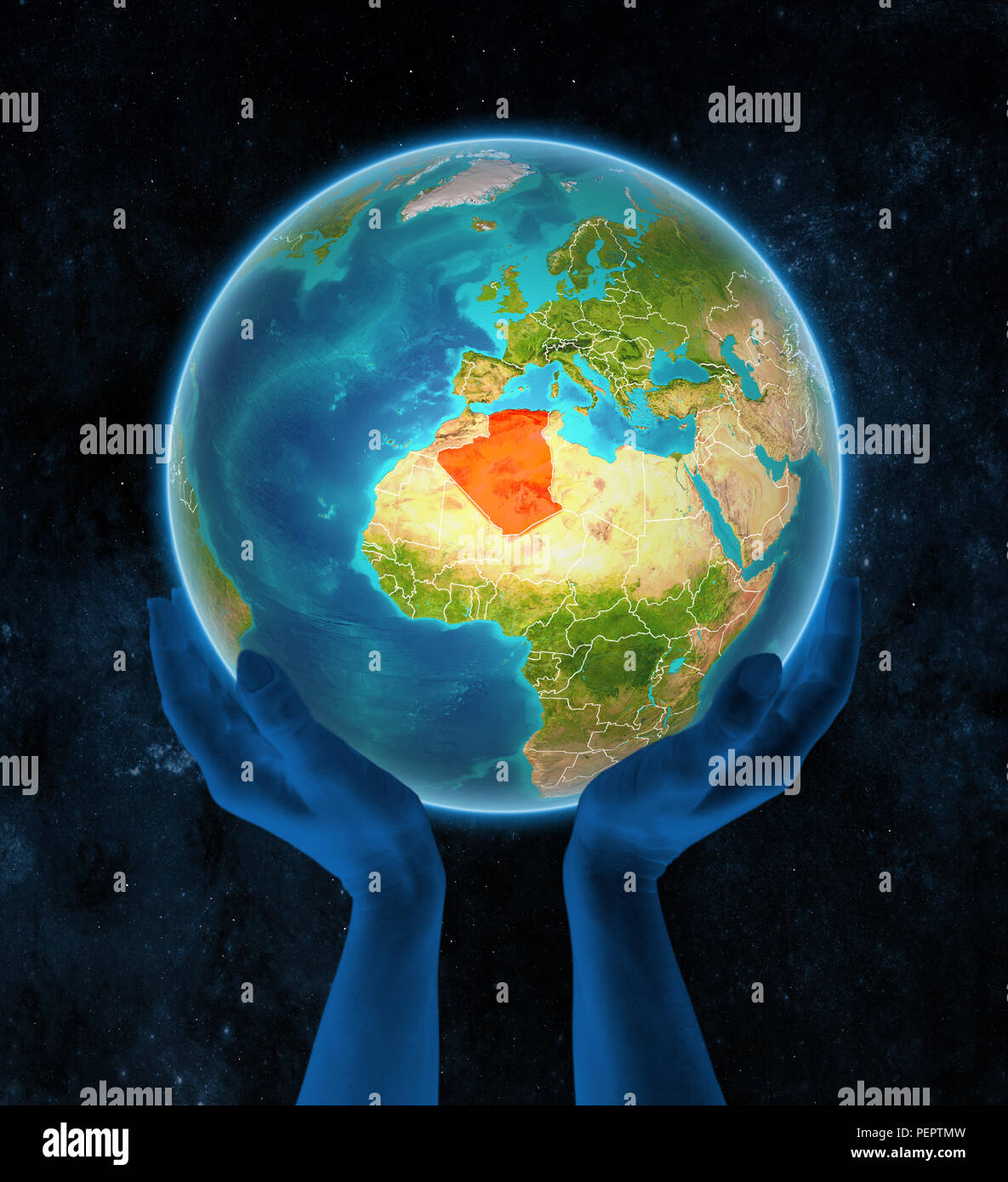 Algeria on planet Earth with visible country borders in hands in space ...