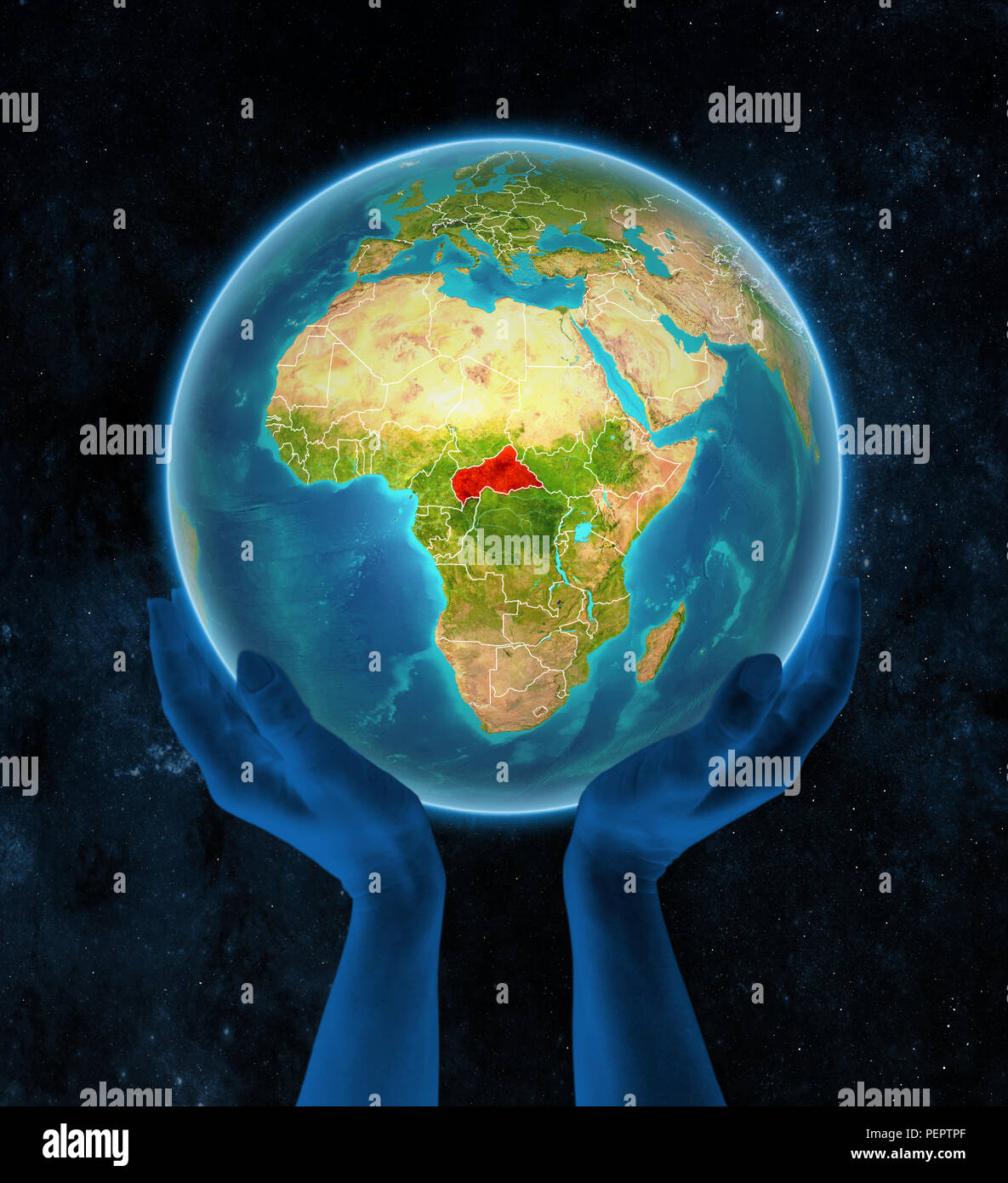 Central Africa on planet Earth with visible country borders in hands in ...